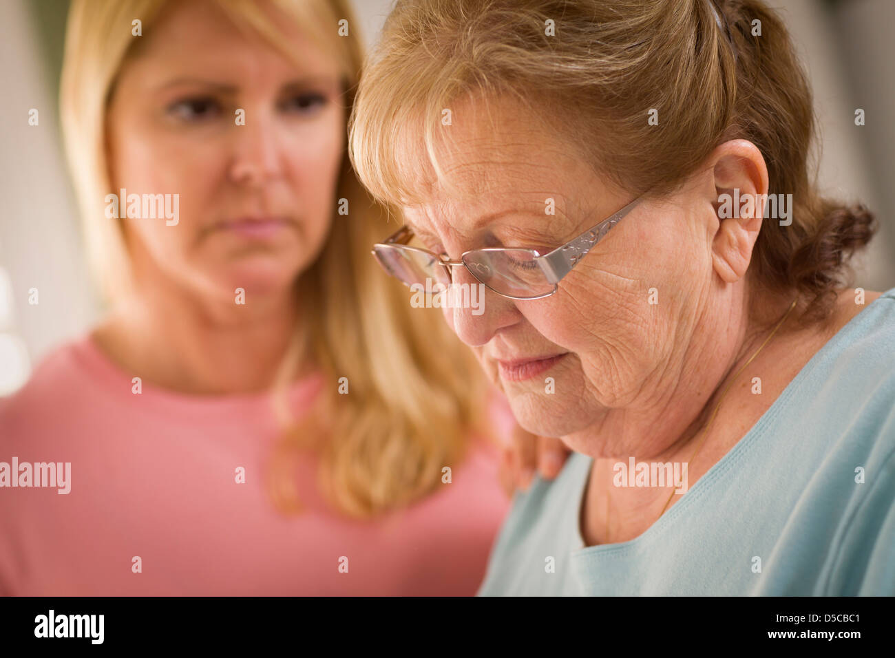 Young Adult Woman Consoles Sad Senior Adult Female Stock Photo - Alamy