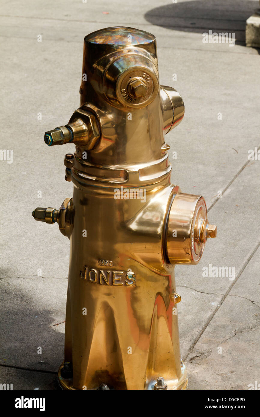 A shiny brass fire hydrant on the street in Santa Barbara, California ...