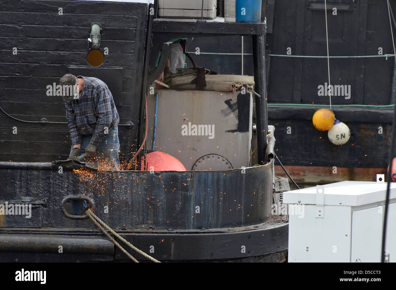 Welder repairing a fishing boat, Petersburg, Alaska Stock Photo - Alamy