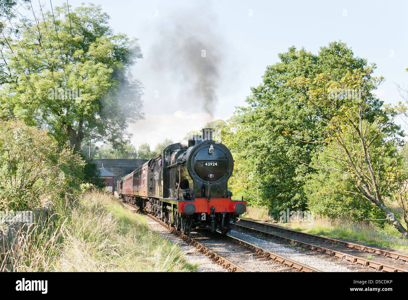 Steam locomotive pulling a passenger train on the Keighley and Worth ...