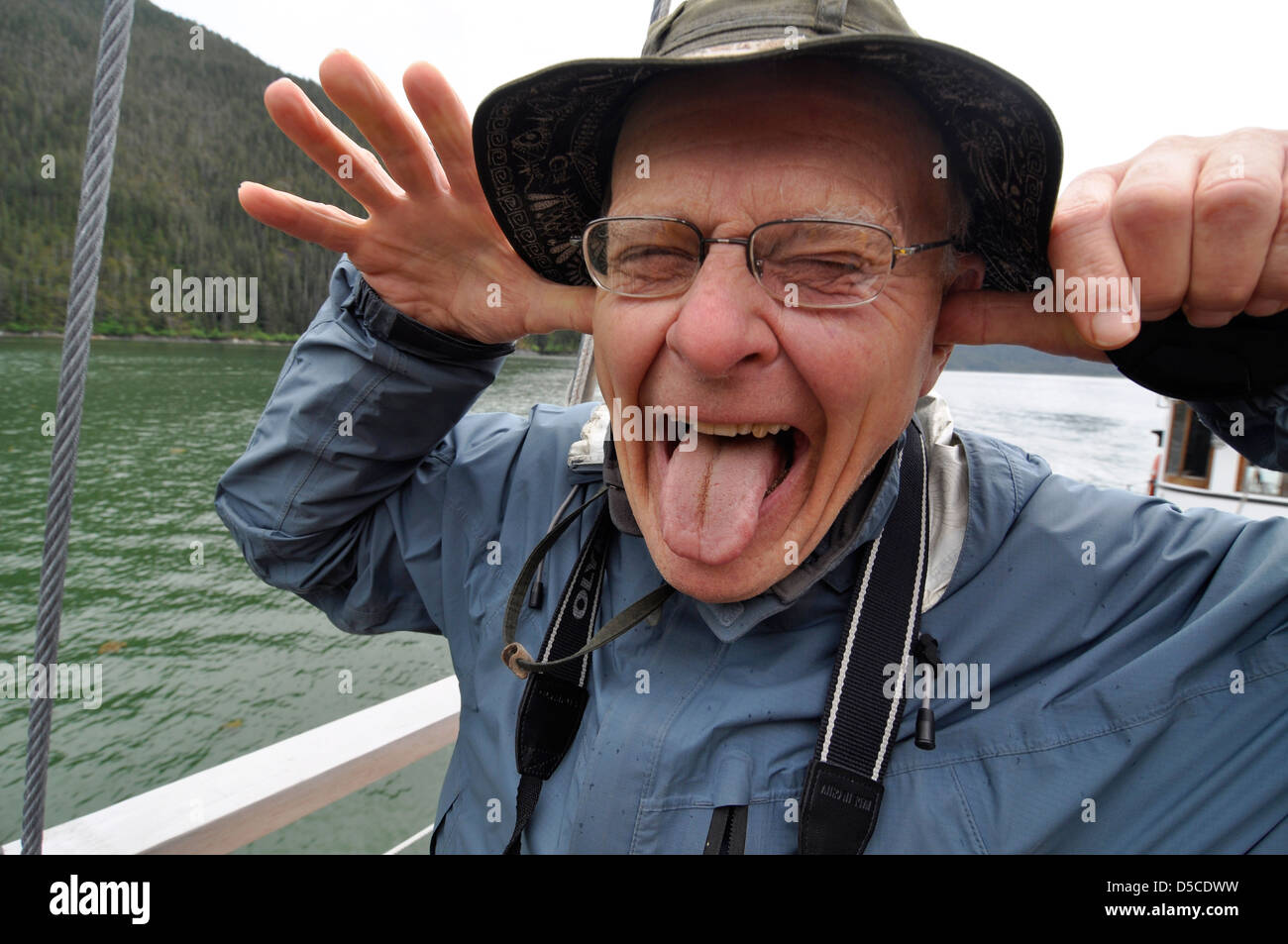 Making a funny face on a boat in Southeast Alaska Stock Photo - Alamy