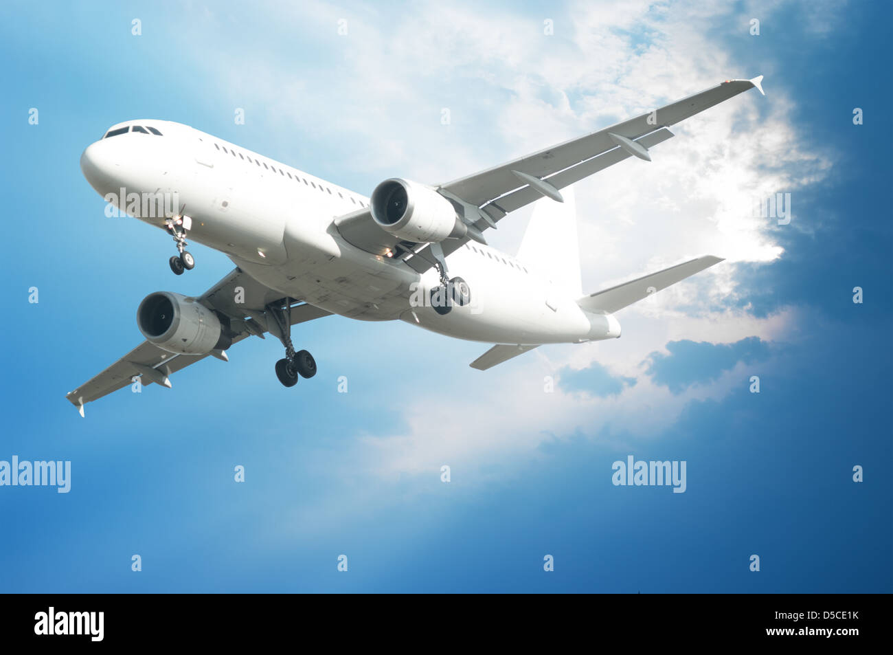 Airplane flying in the air Stock Photo - Alamy