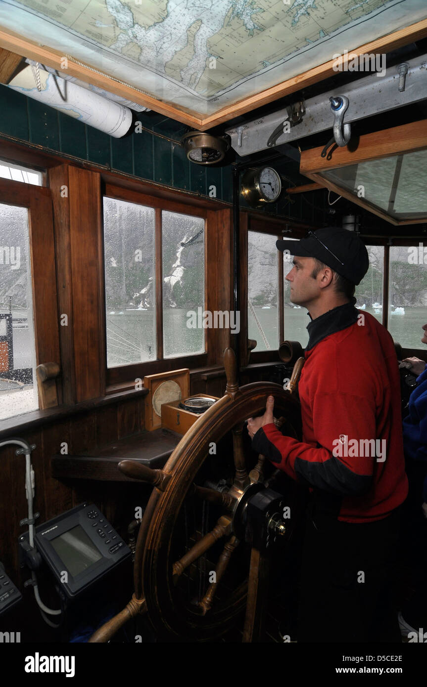 Captaining a small tour boat in Southeast Alaska Stock Photo - Alamy