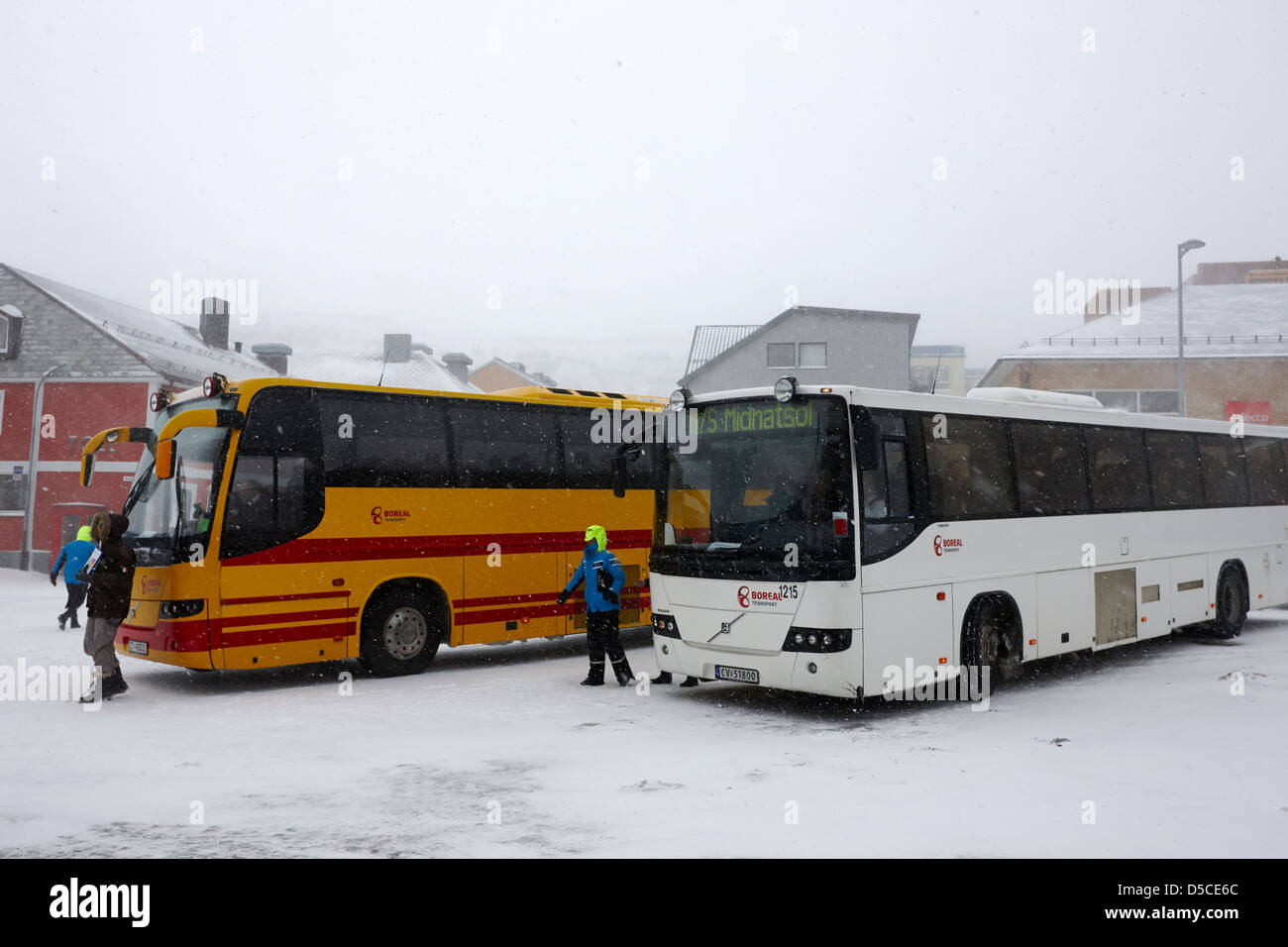 coaches waiting in the snow for passengers from hurtigruten ferries ...