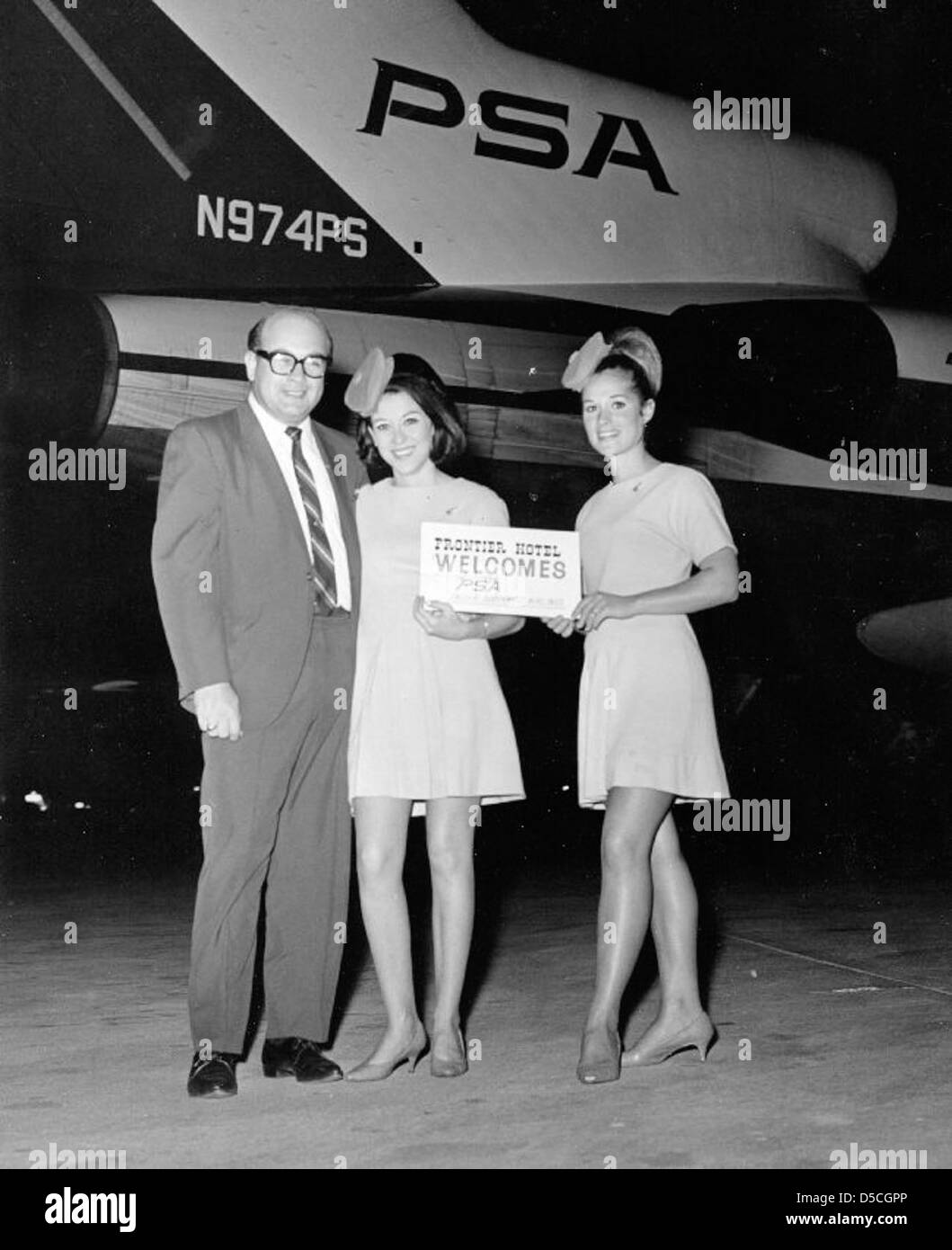 This image captures a flight attendant from Pacific Southwest Airlines ...