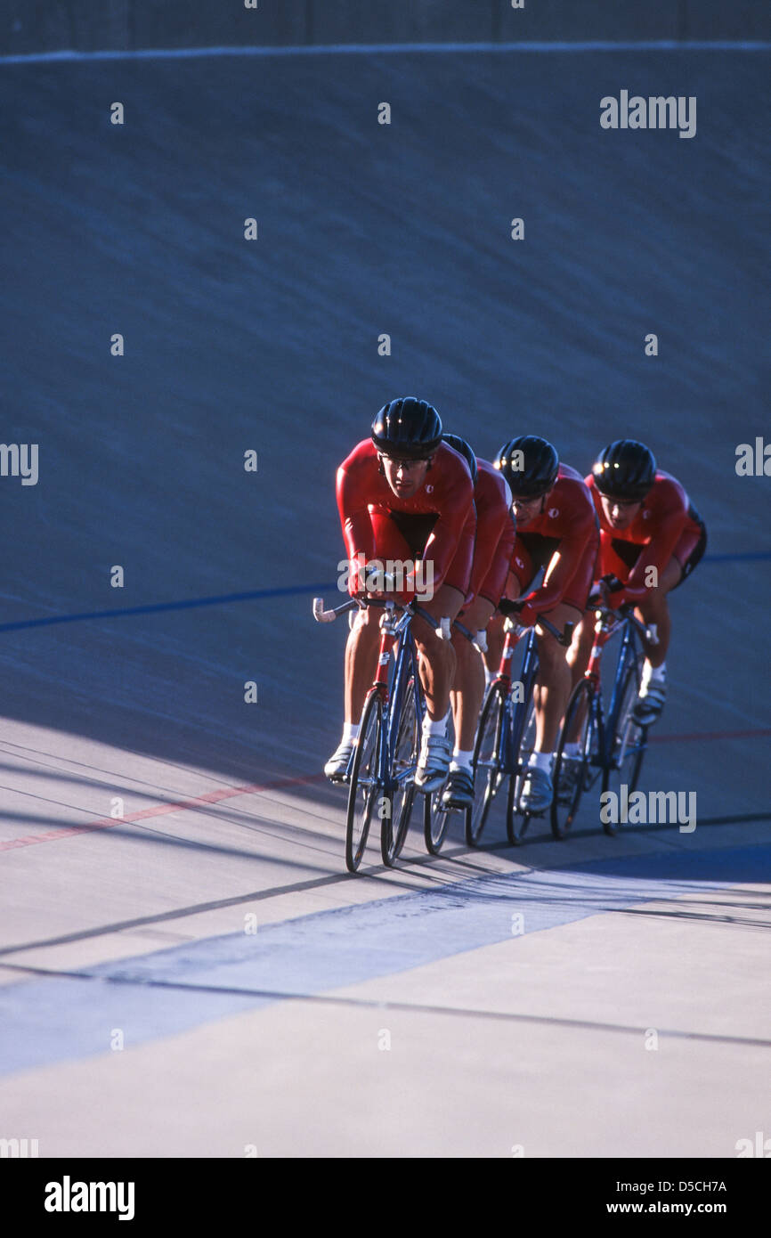 Male cycling team on the velodrome Stock Photo - Alamy