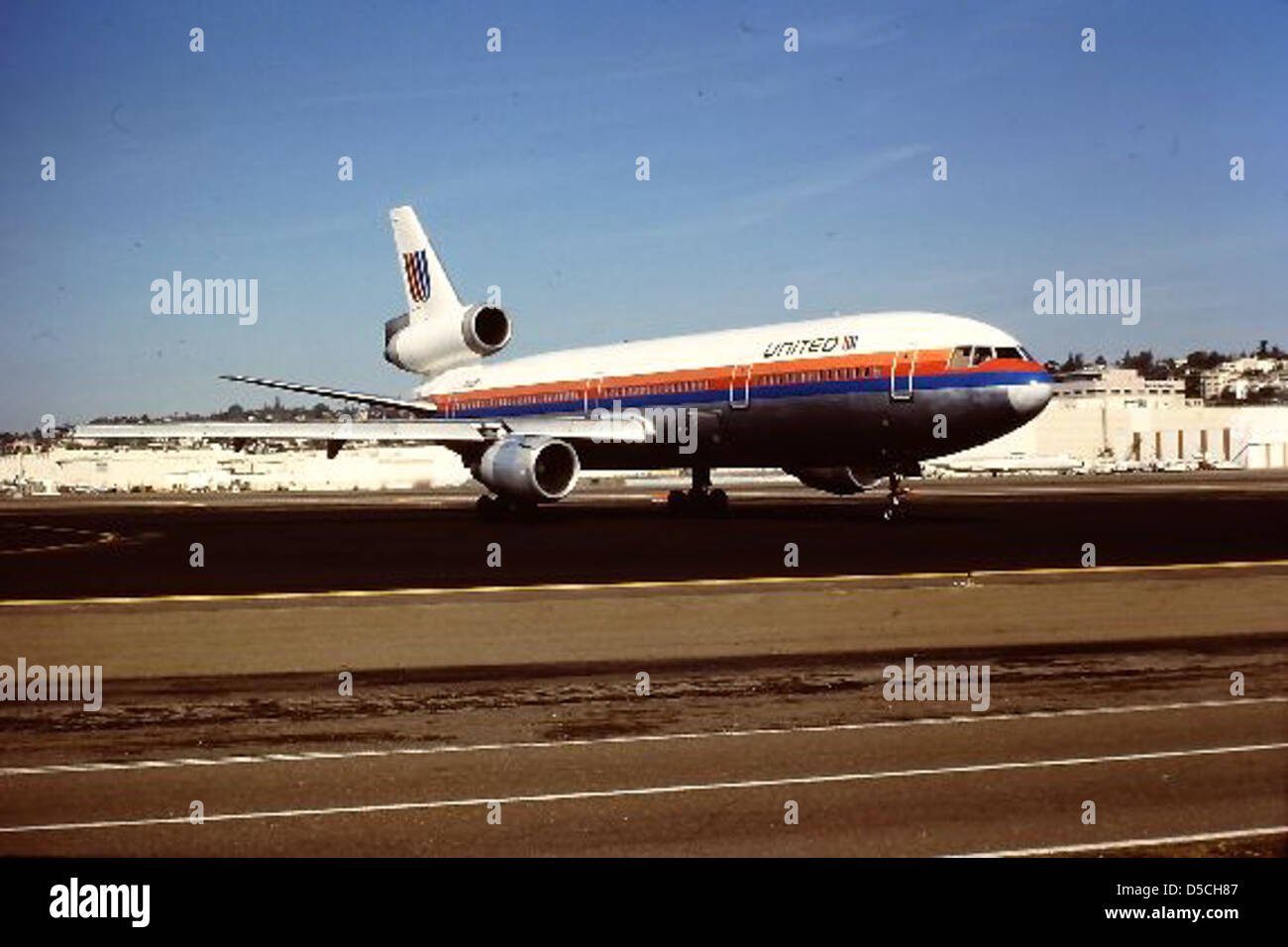 The image depicts the Douglas DC-10, an iconic wide-body airliner ...
