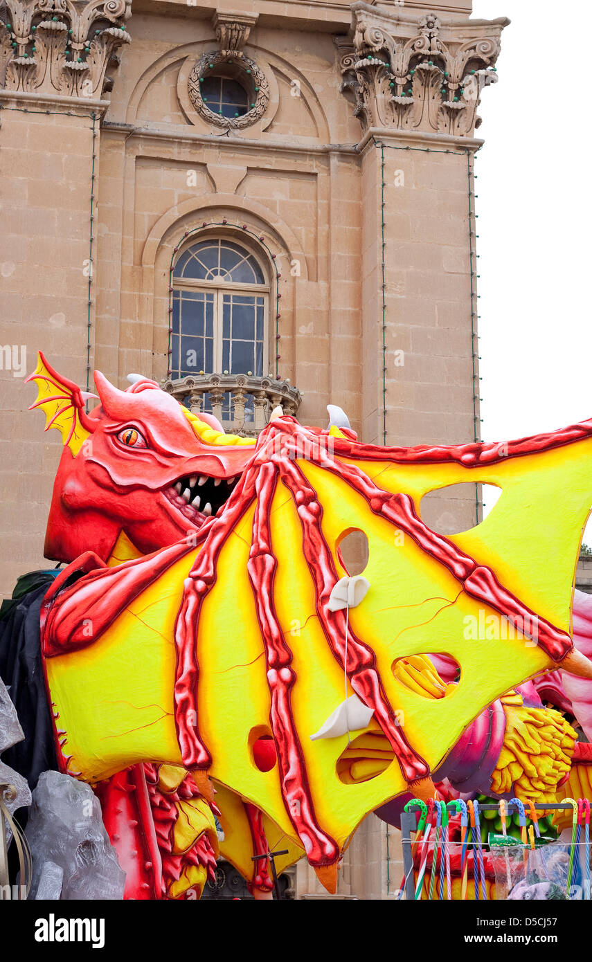 A colorful dragon made out of papier mache used during carnival ...
