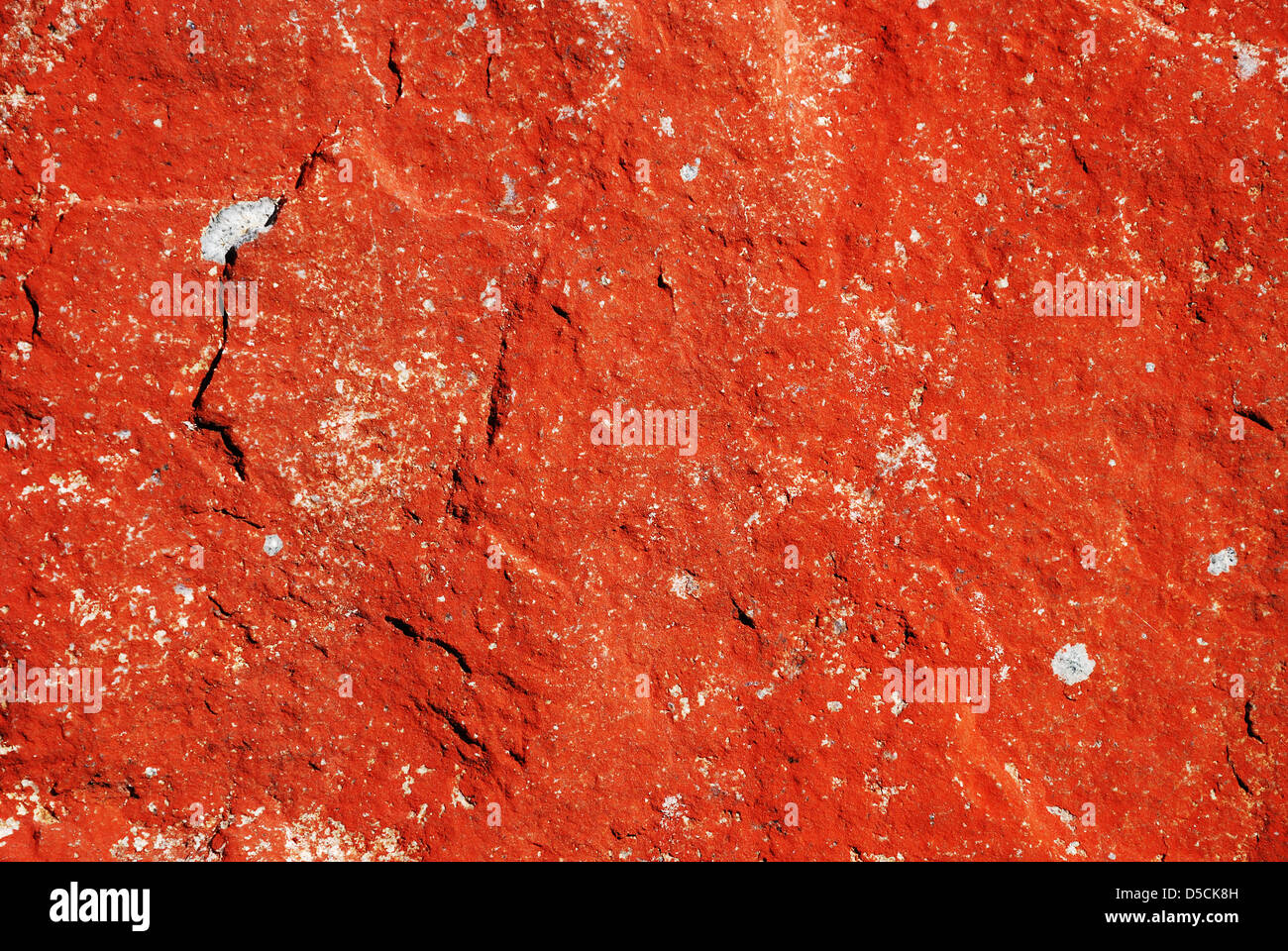 Red background of the mossy stone surface Stock Photo - Alamy