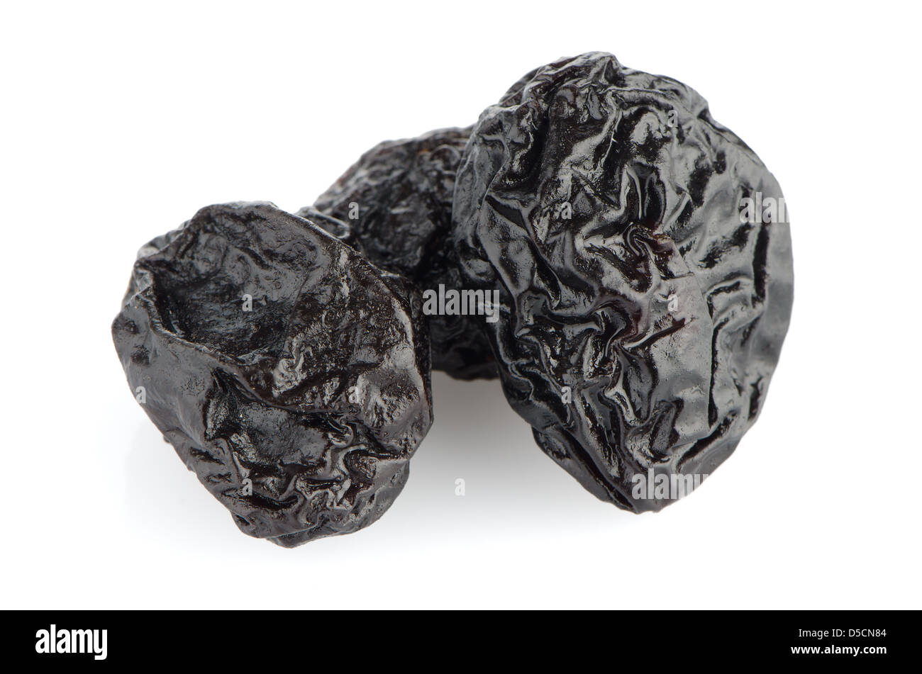 Dried plum fruits - prunes isolated on white background Stock Photo - Alamy