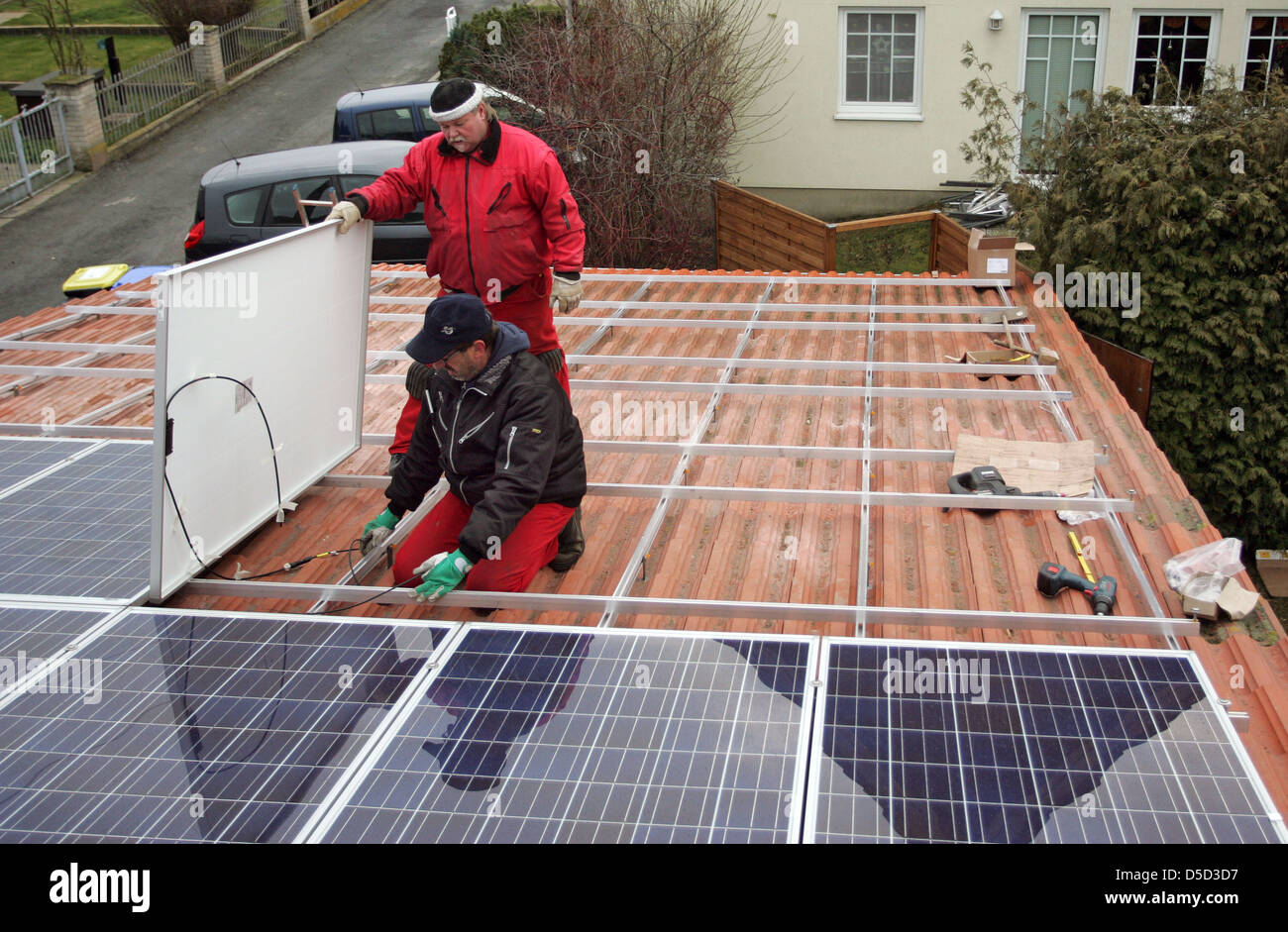 Magdeburg, Germany, installing a solar power system on the roof of a ...