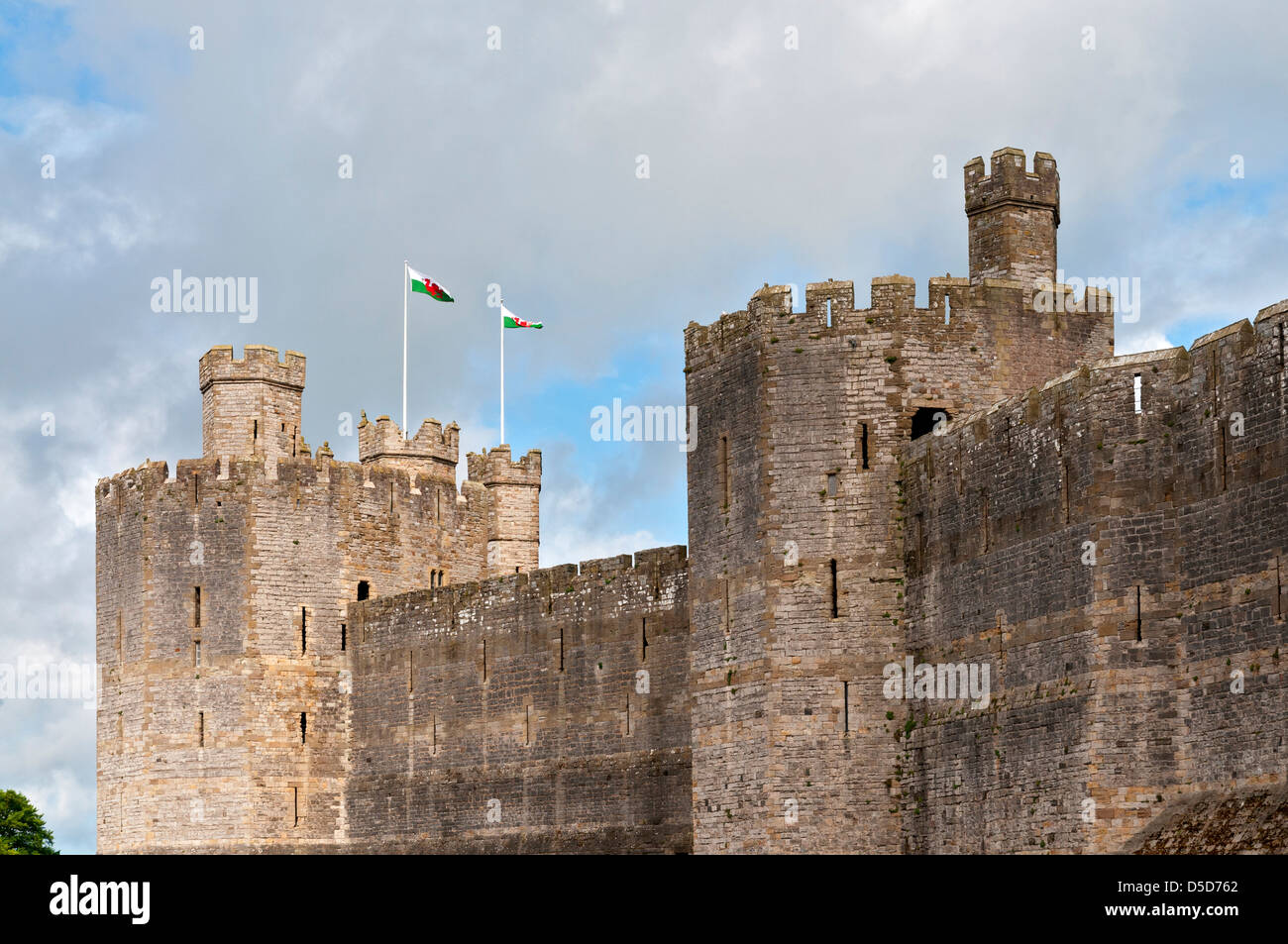 Wales, County Gwynedd, Caernarfon Castle, Welsh flags atop Eagle Tower ...