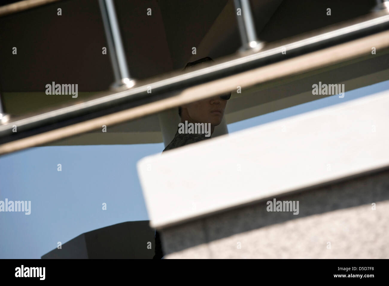 A Republic of Korea soldier keeps watch inside a watch tower inside the ...