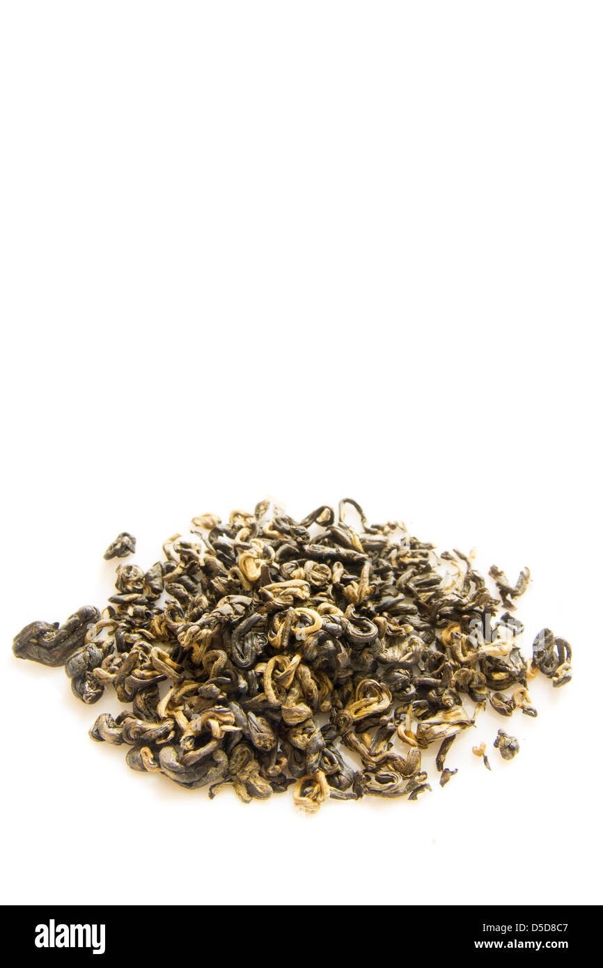 Heap of green tea close up isolated on white background Stock Photo - Alamy