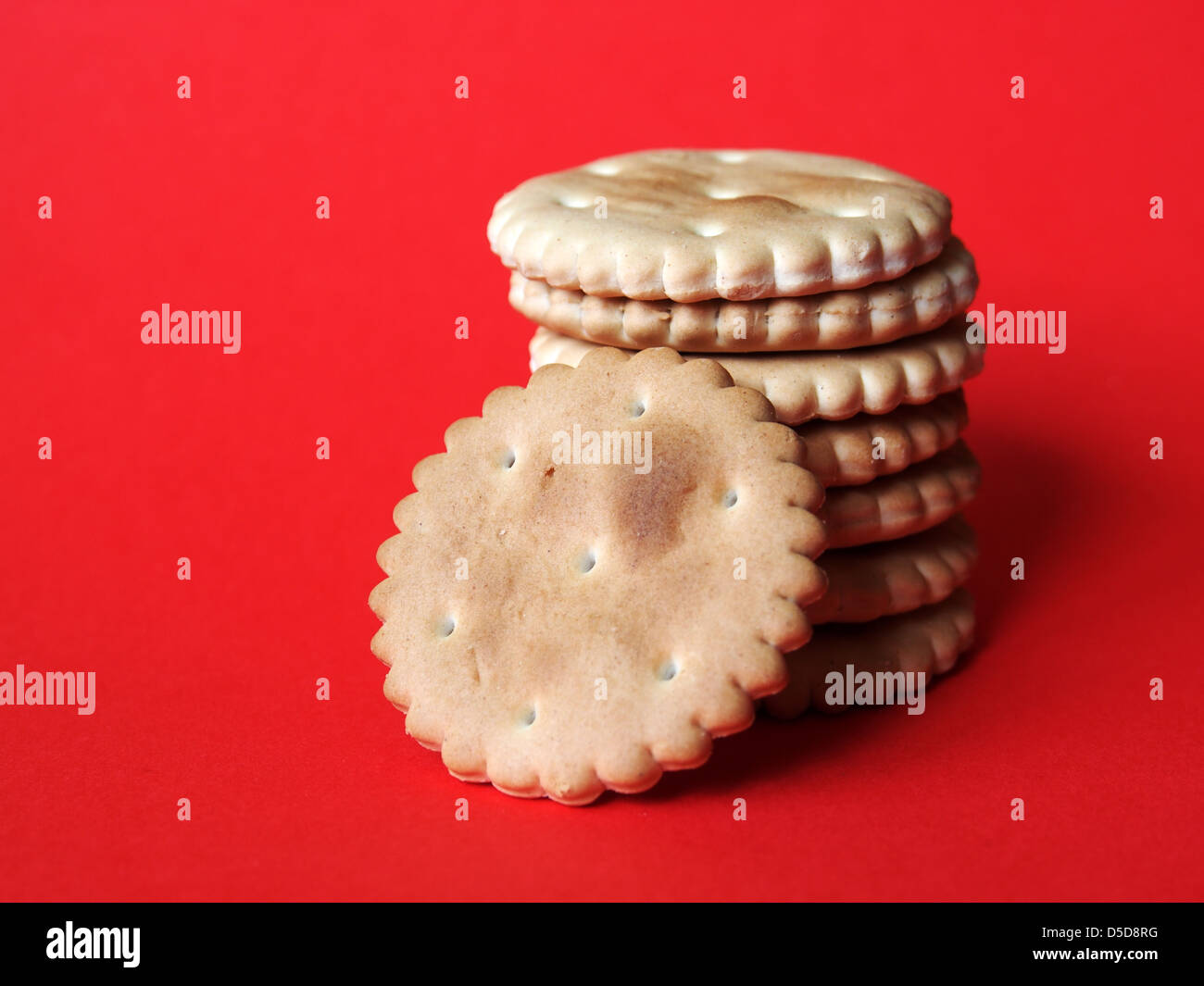 crackers on a red background Stock Photo - Alamy