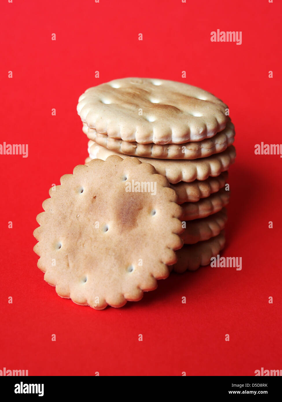 crackers on a red background Stock Photo - Alamy