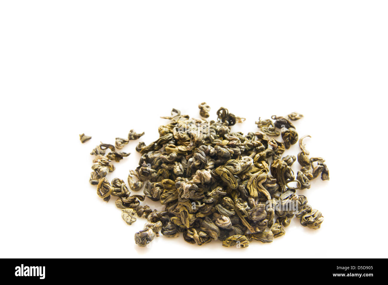 Heap of green tea close up isolated on white background Stock Photo - Alamy