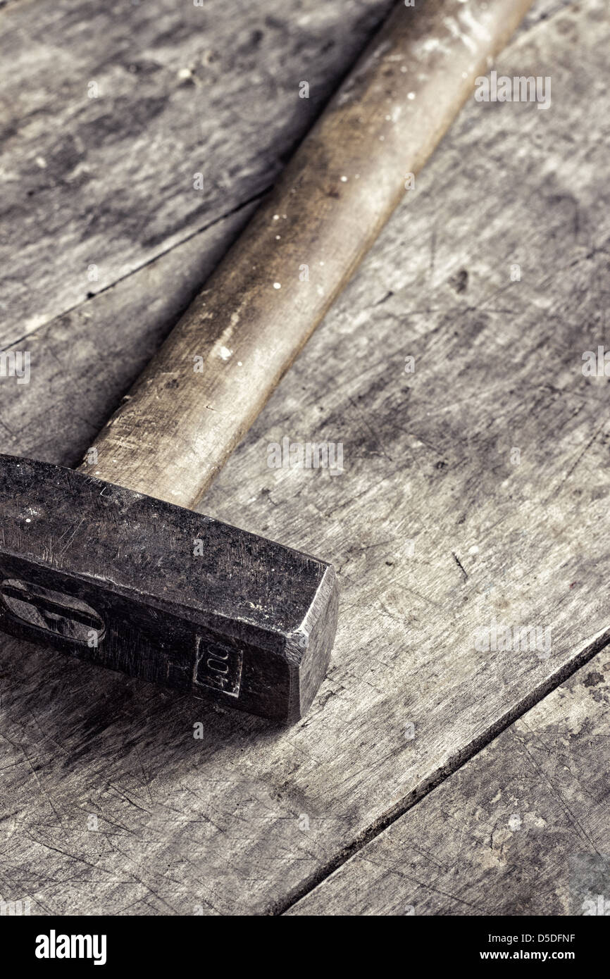 old hammer on old table,close up Stock Photo - Alamy