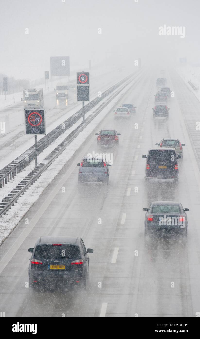 Cars drive on Autobahn A12 in driving snow near Jacobsdorf, Germany, 29 ...