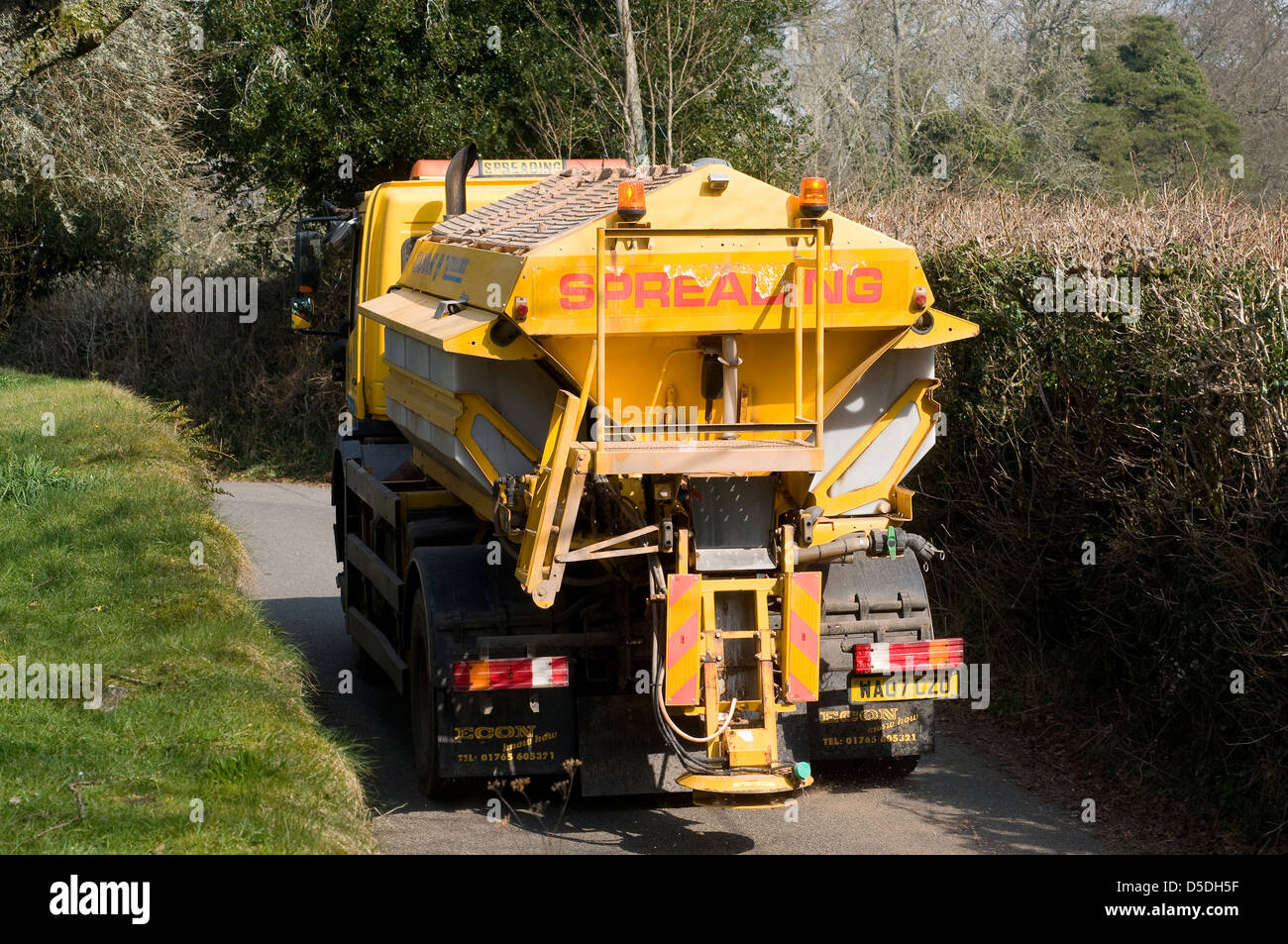 spreading salt on Devon lane,salting Stock Photo - Alamy