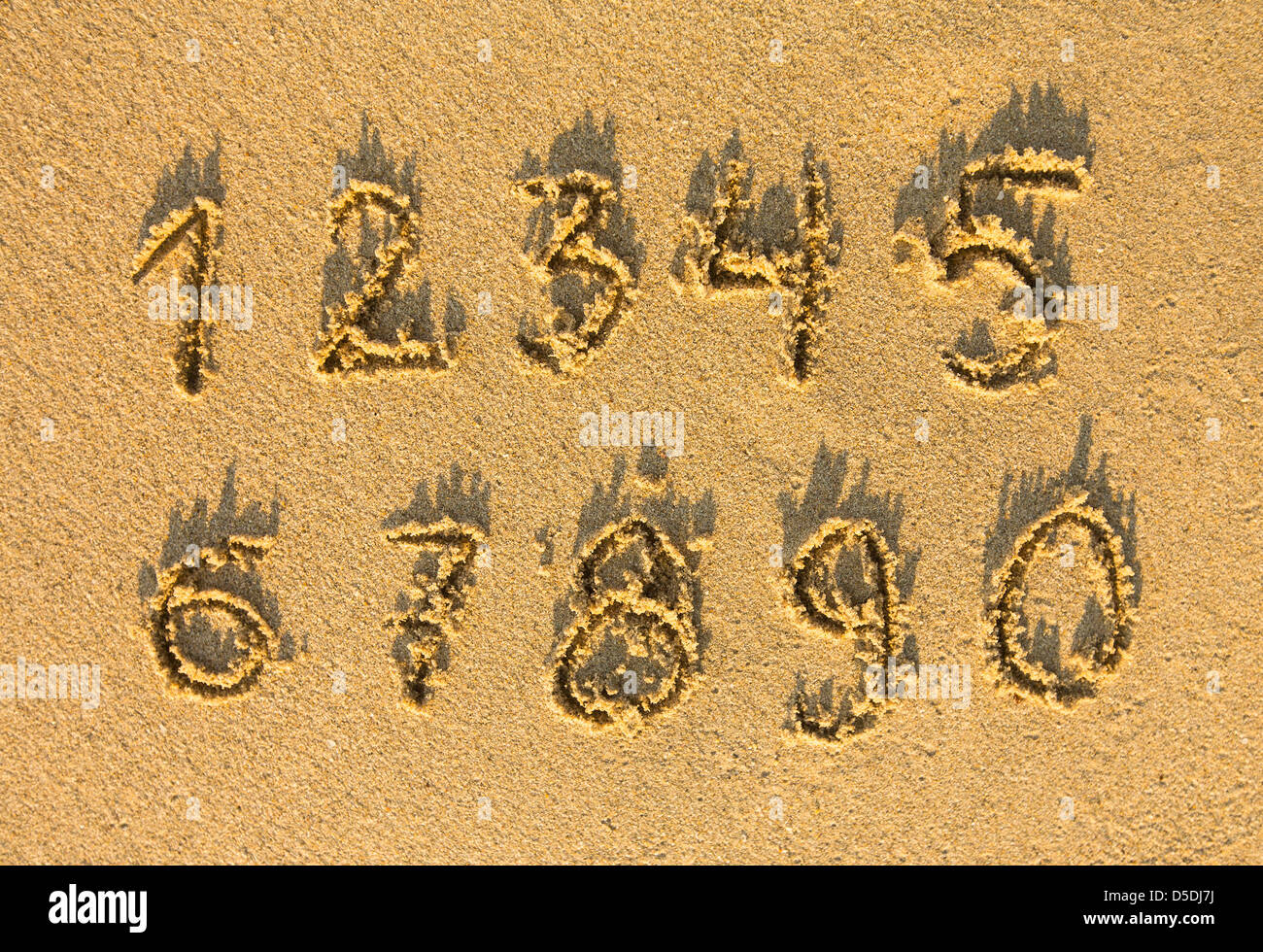 Numbers from one to ten written on a sandy beach Stock Photo - Alamy