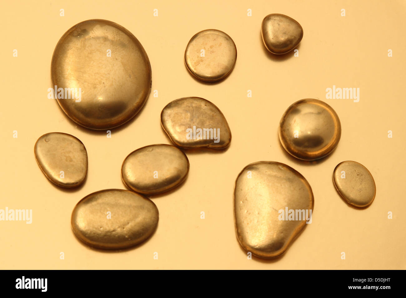 Gold pebbles hi-res stock photography and images - Alamy