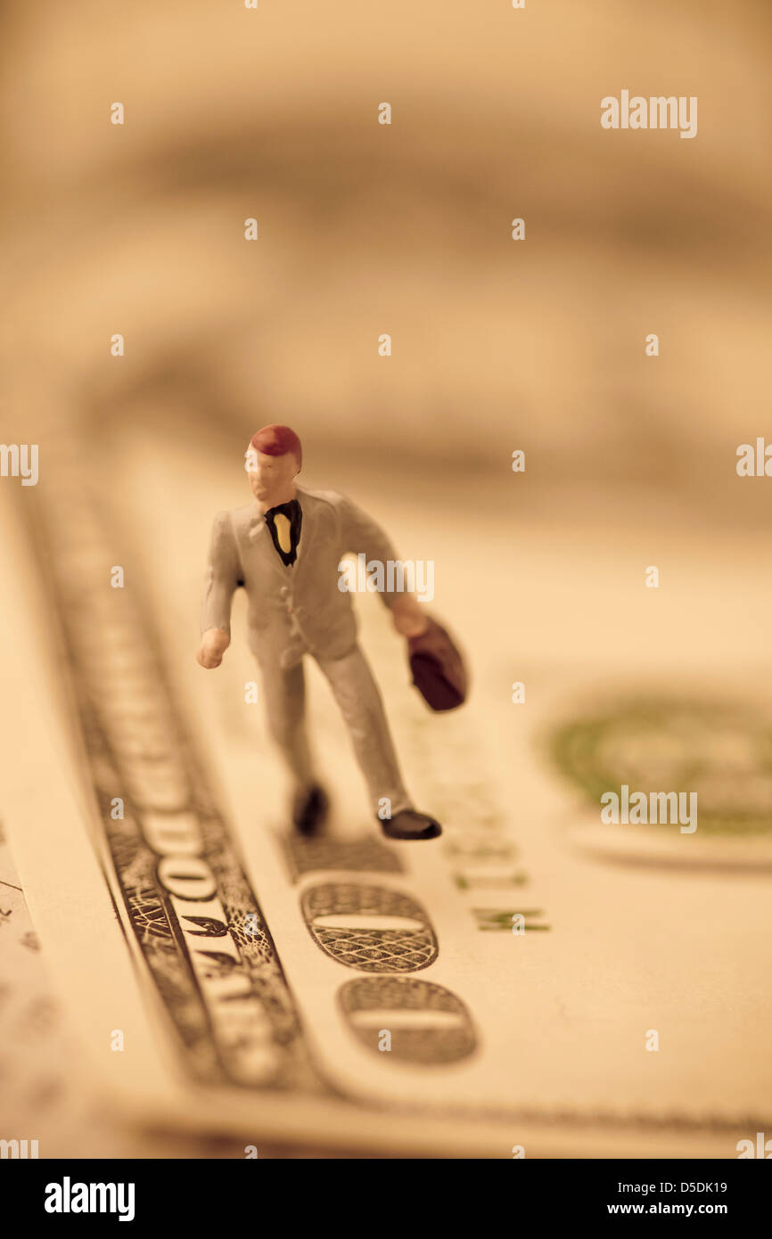 figure of businessman on 100 dollars banknote Stock Photo - Alamy