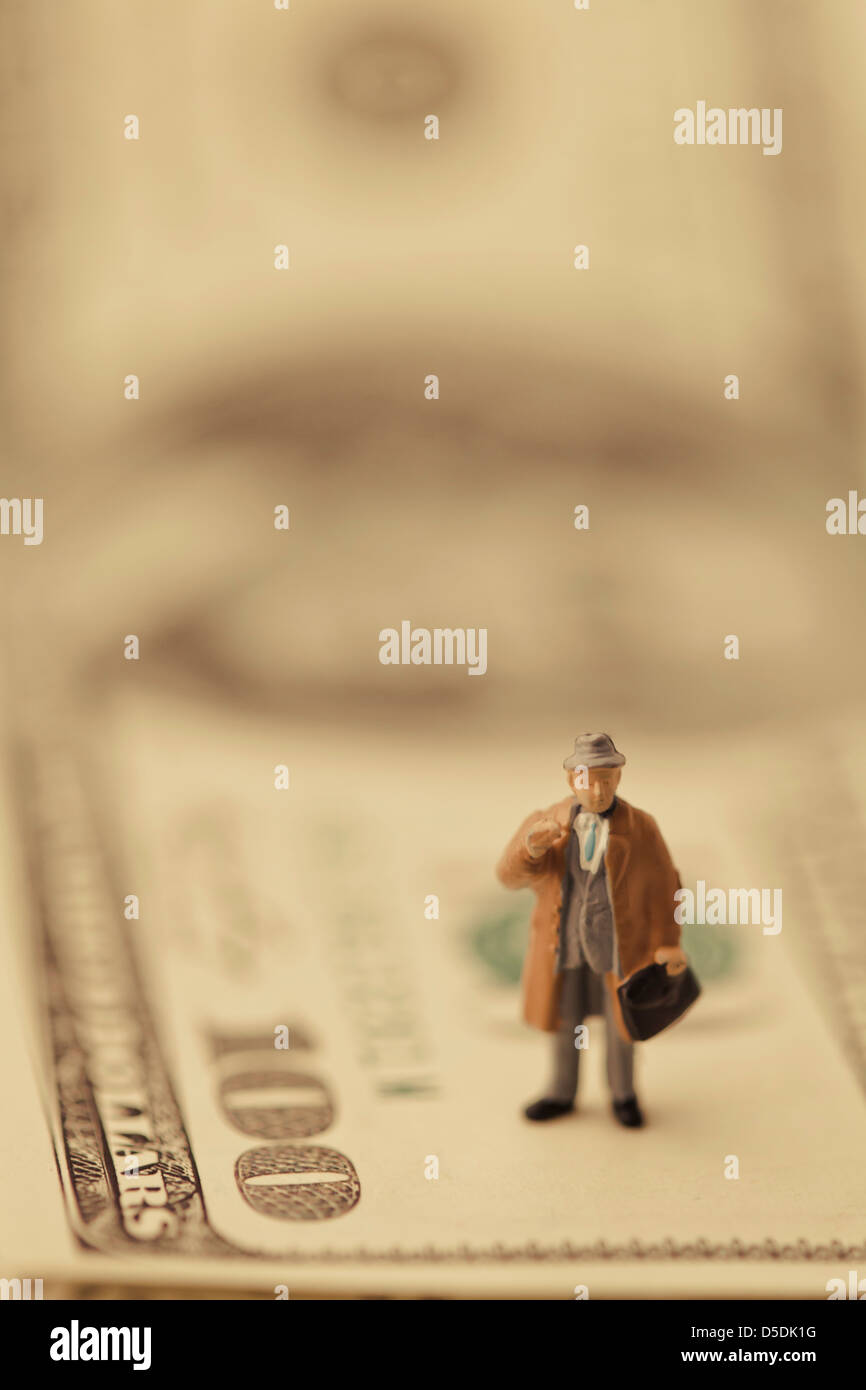 figure of businessman on 100 dollars banknote Stock Photo - Alamy
