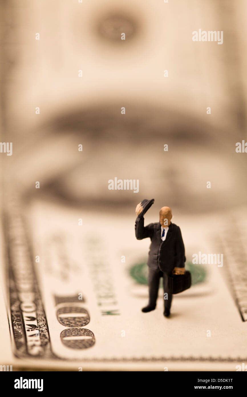 figure of businessman on 100 dollars banknote Stock Photo - Alamy
