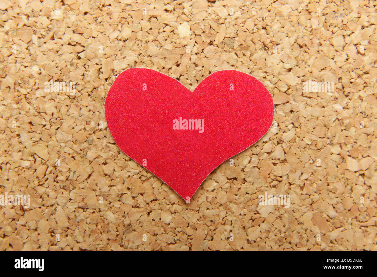 red heart on cork background Stock Photo - Alamy