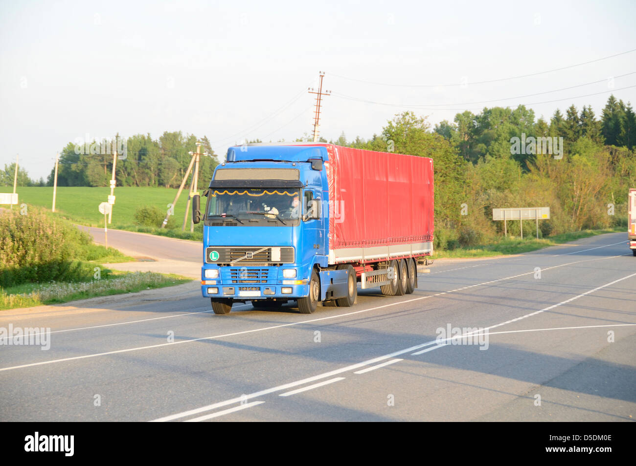 The heavy truck goes on highway Stock Photo - Alamy