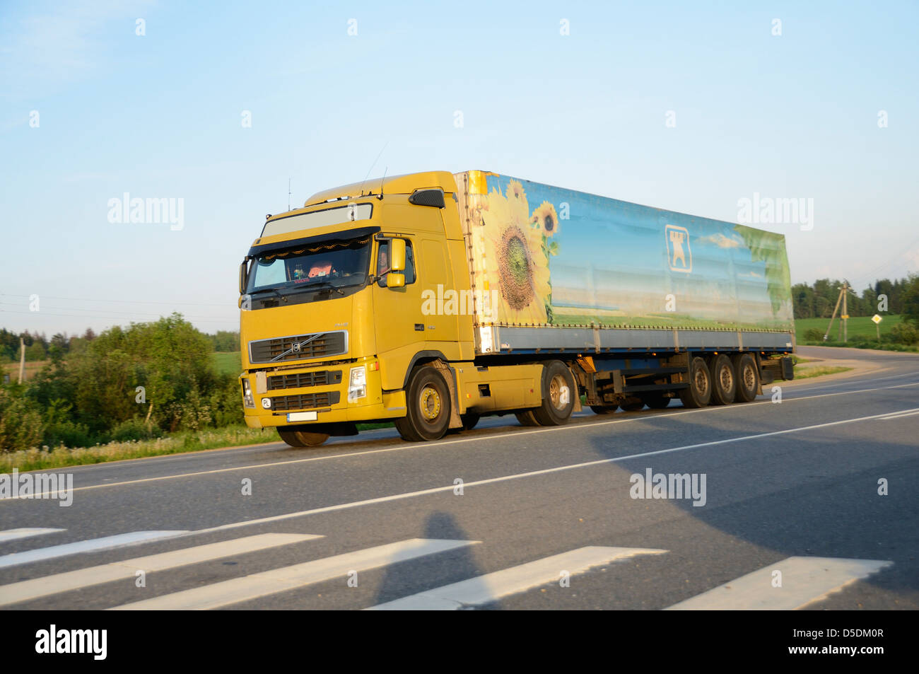 The heavy truck goes on highway Stock Photo - Alamy