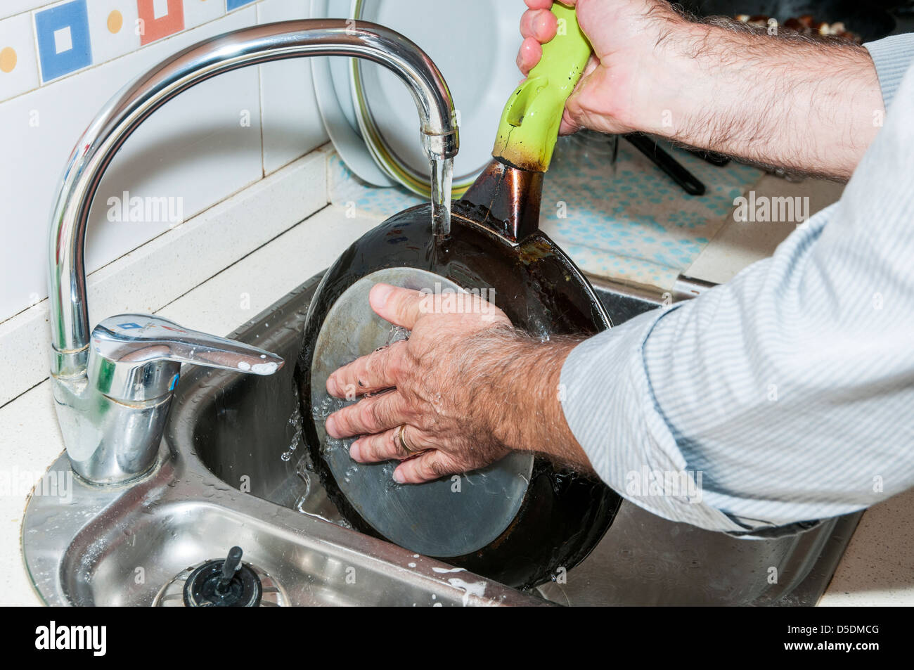 washing dishes in the kitchen and leaving them perfectly clean Stock ...