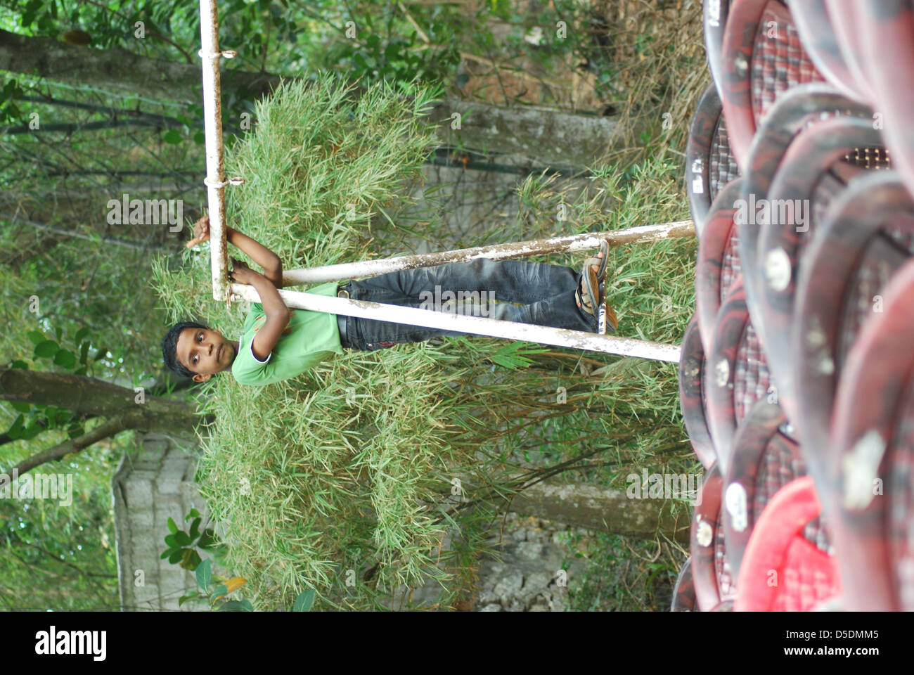 Boy playing by himself Stock Photo - Alamy