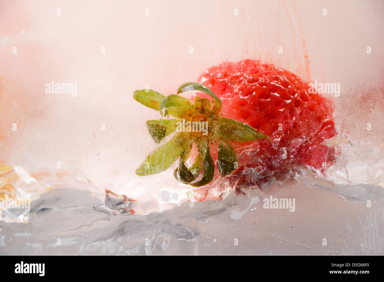 Strawberries in ice Stock Photo - Alamy