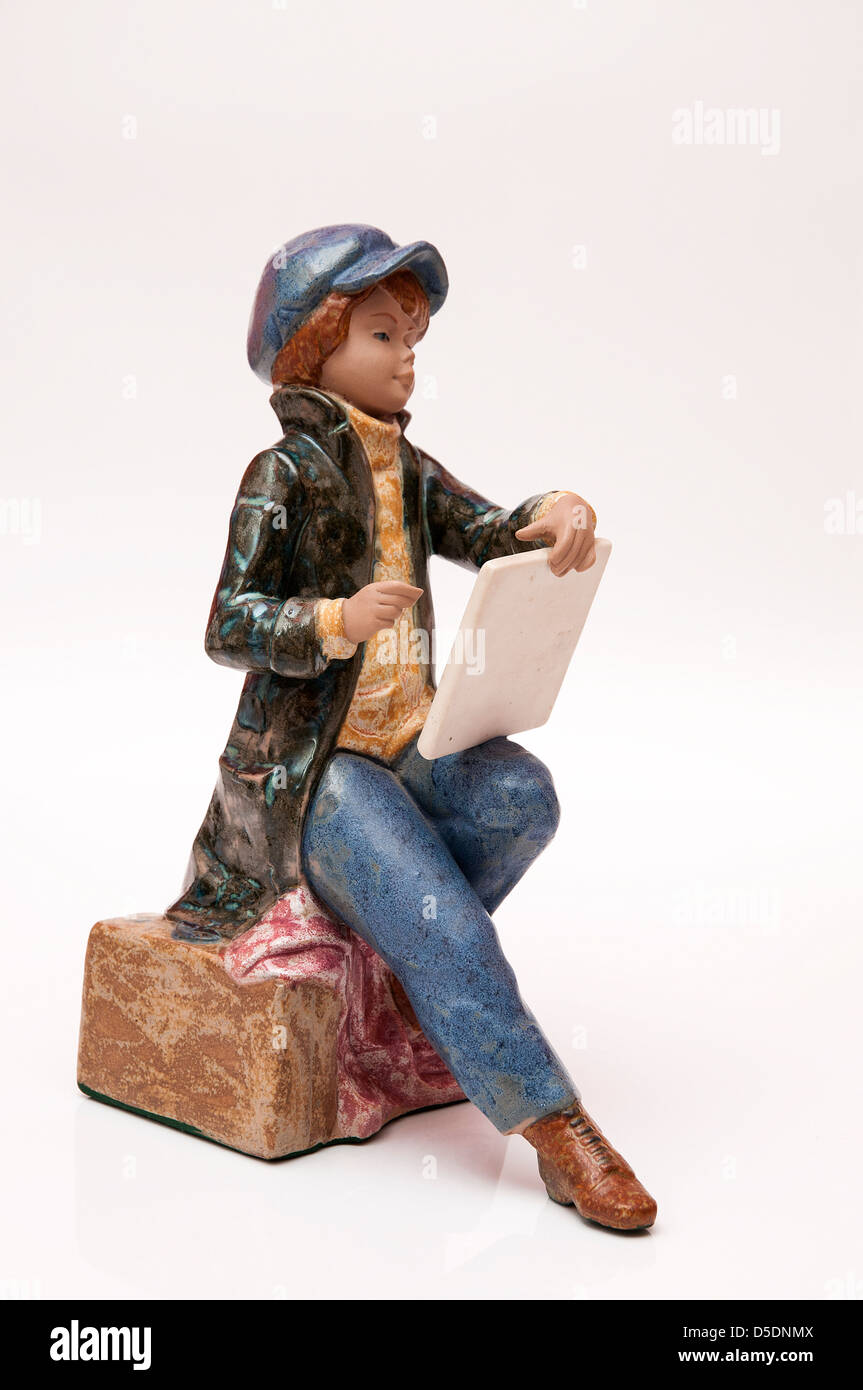 statue of a seated man painting a painting Stock Photo - Alamy