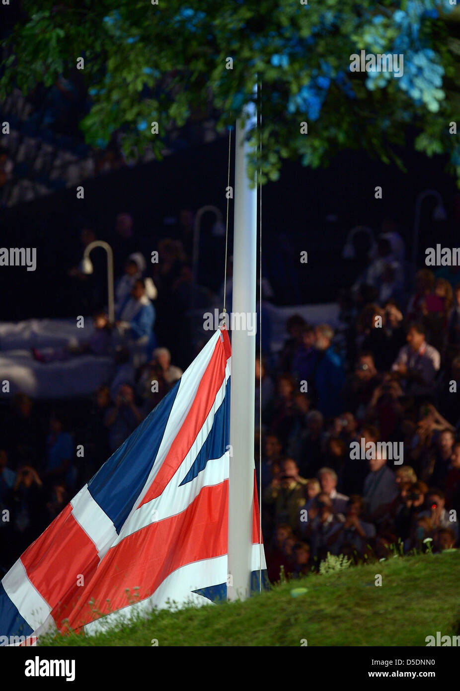 The olympic flag is raised hi-res stock photography and images - Alamy