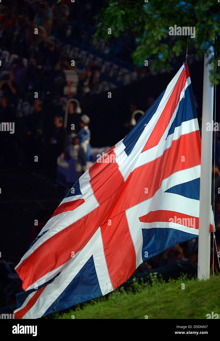 The olympic flag is raised hi-res stock photography and images - Alamy