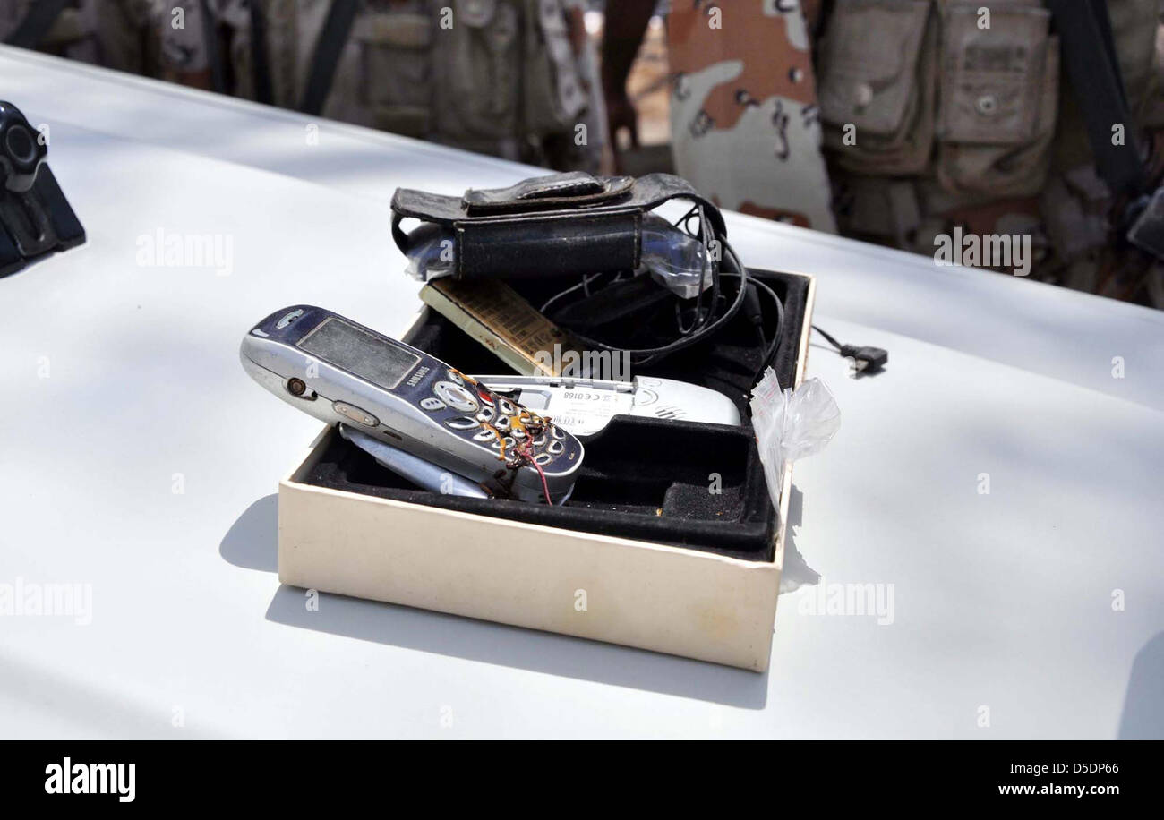 Rangers officials showing cell phone detonators that recovered from ...