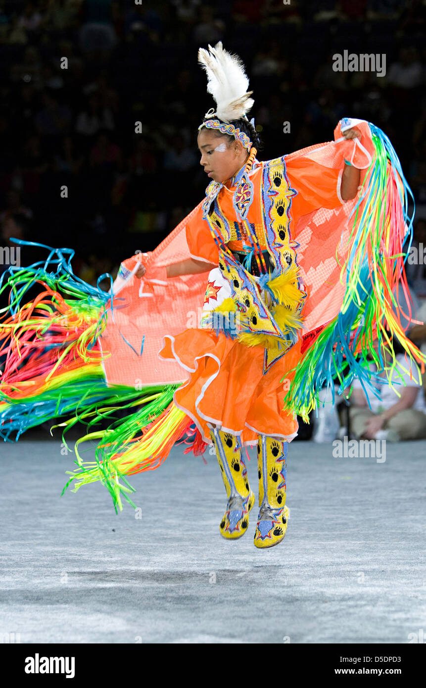 A photograph of a Native American dancer in full regalia, taken at a ...