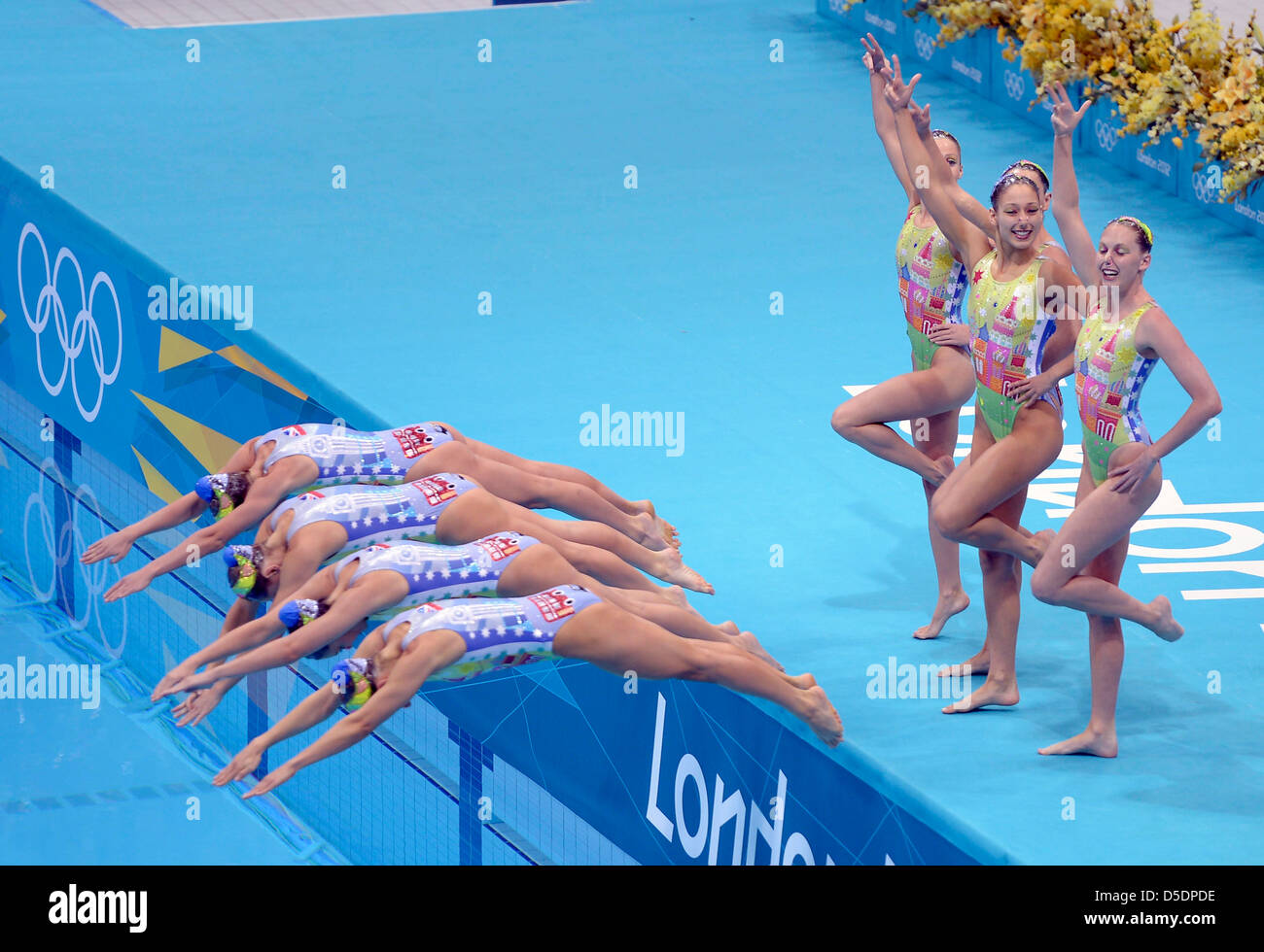 Australia dive into the pool. Synchronised Swimming team Stock Photo ...