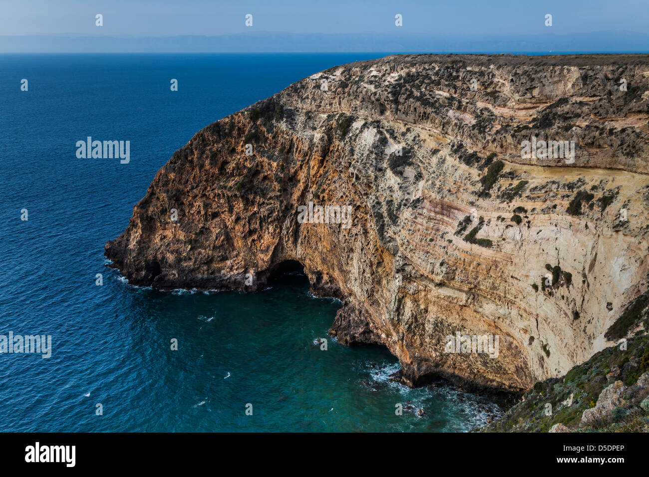 Headlands with wave-cut sea caves near Potato Harbor on Santa Cruz ...