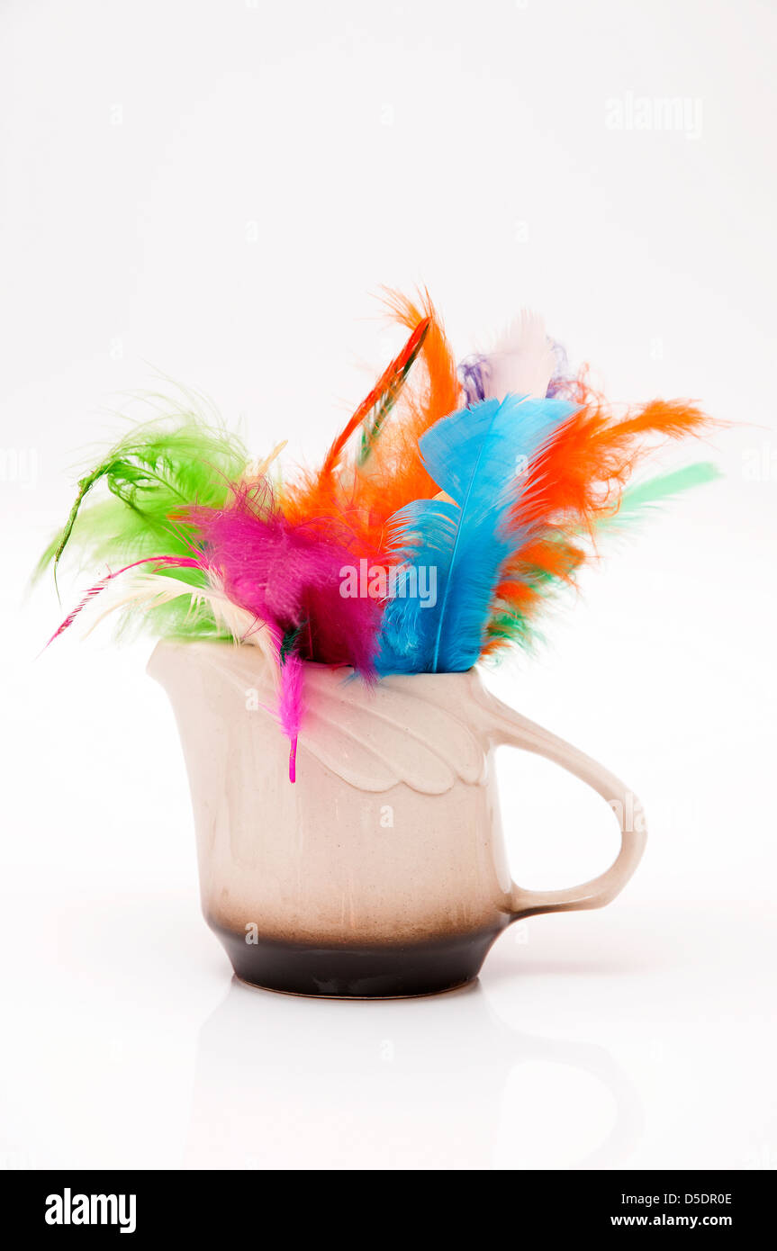container with feathers as decoration Stock Photo - Alamy