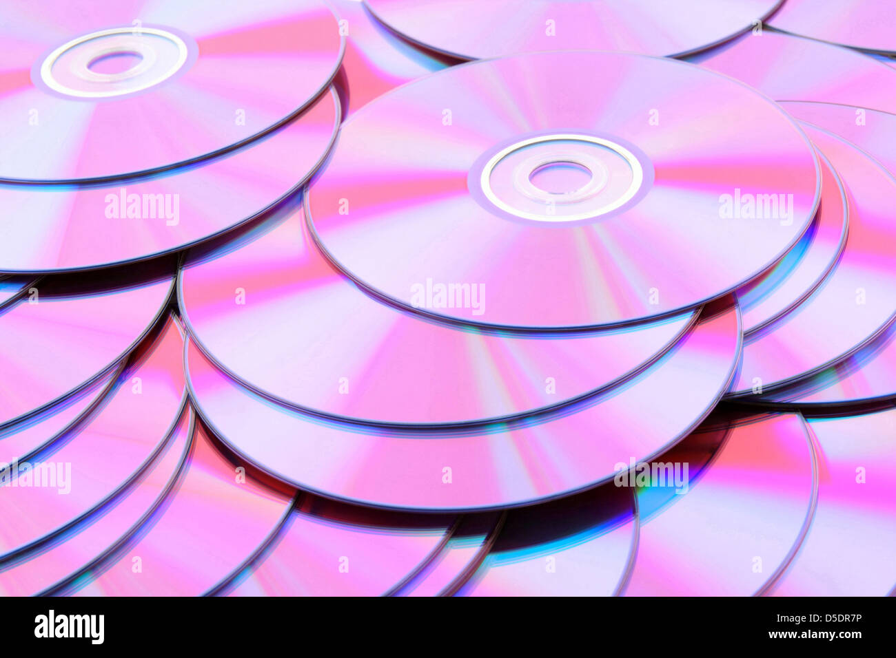 Background of many pink DVDs or CDs. No dust Stock Photo - Alamy