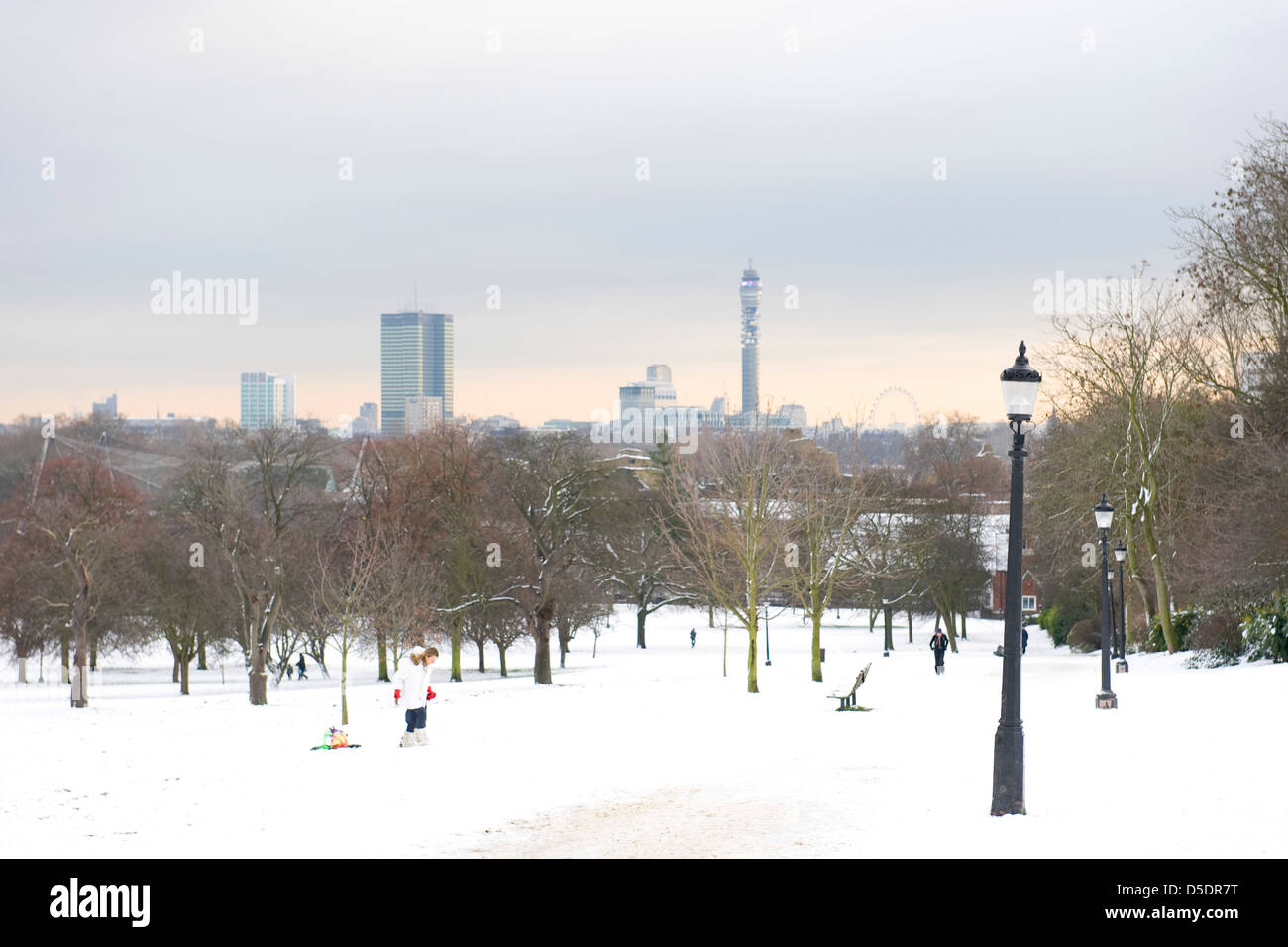 Primrose Hill park in the snow with a view of central London behind ...