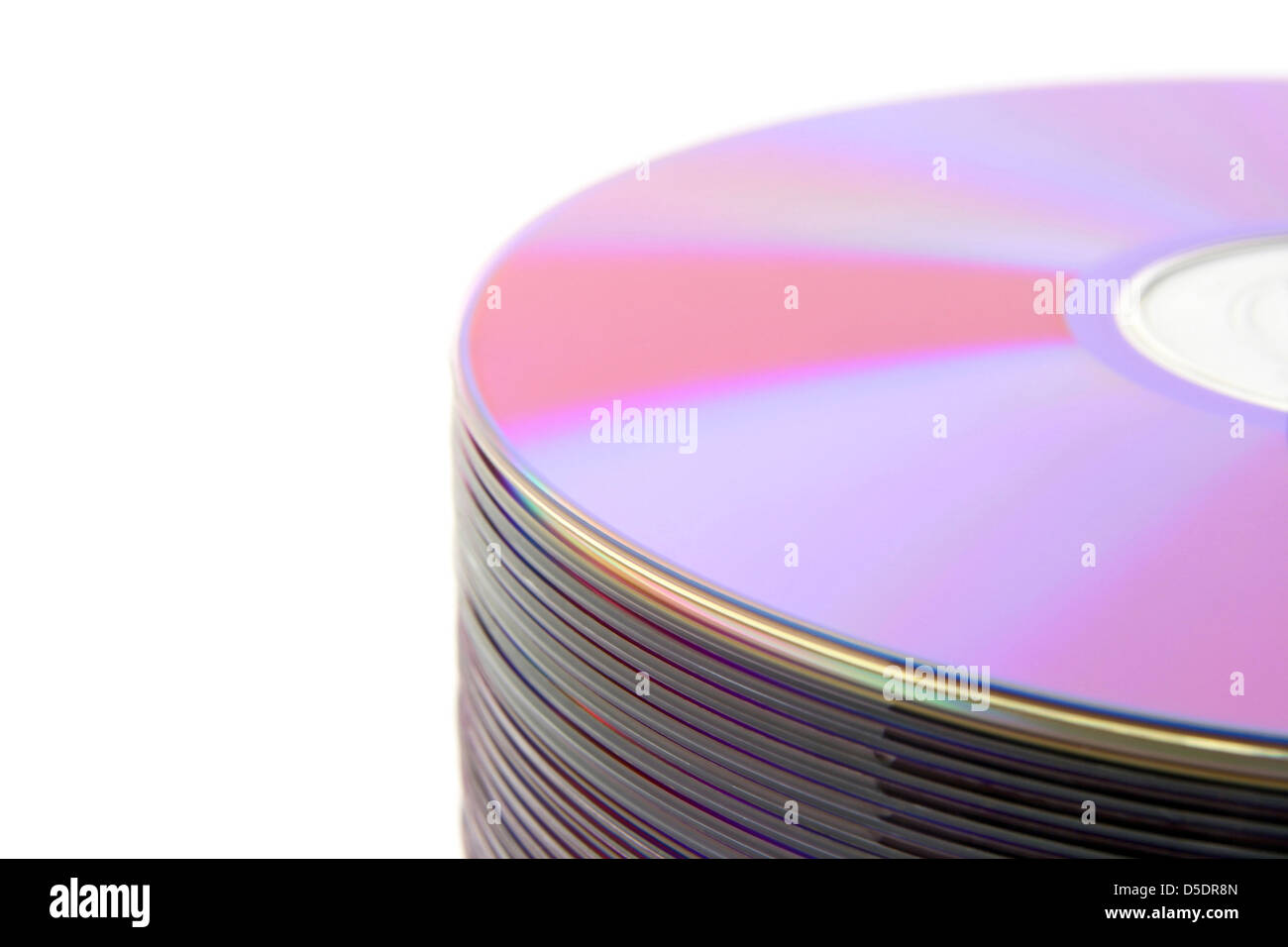 Close-up of stacked purple DVDs or CDs on white background Stock Photo ...