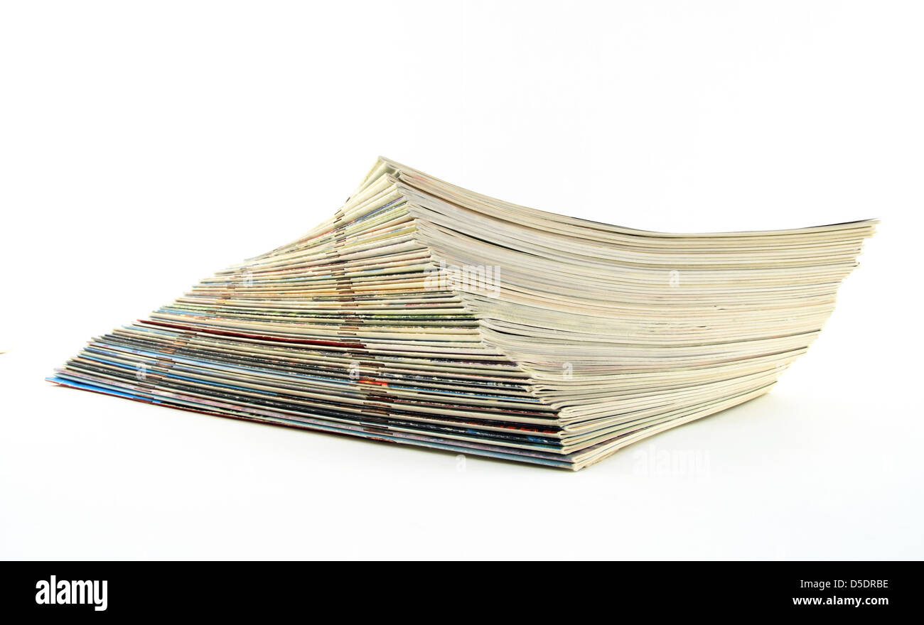 Pile of old weathered magazines on white background Stock Photo - Alamy
