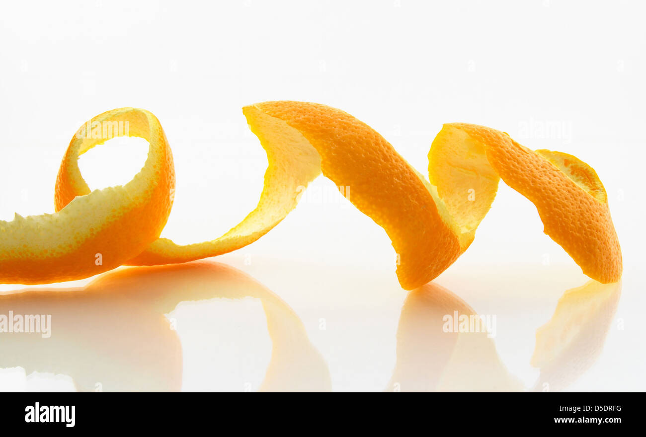 Spiral peeled skin of an orange with reflection Stock Photo - Alamy