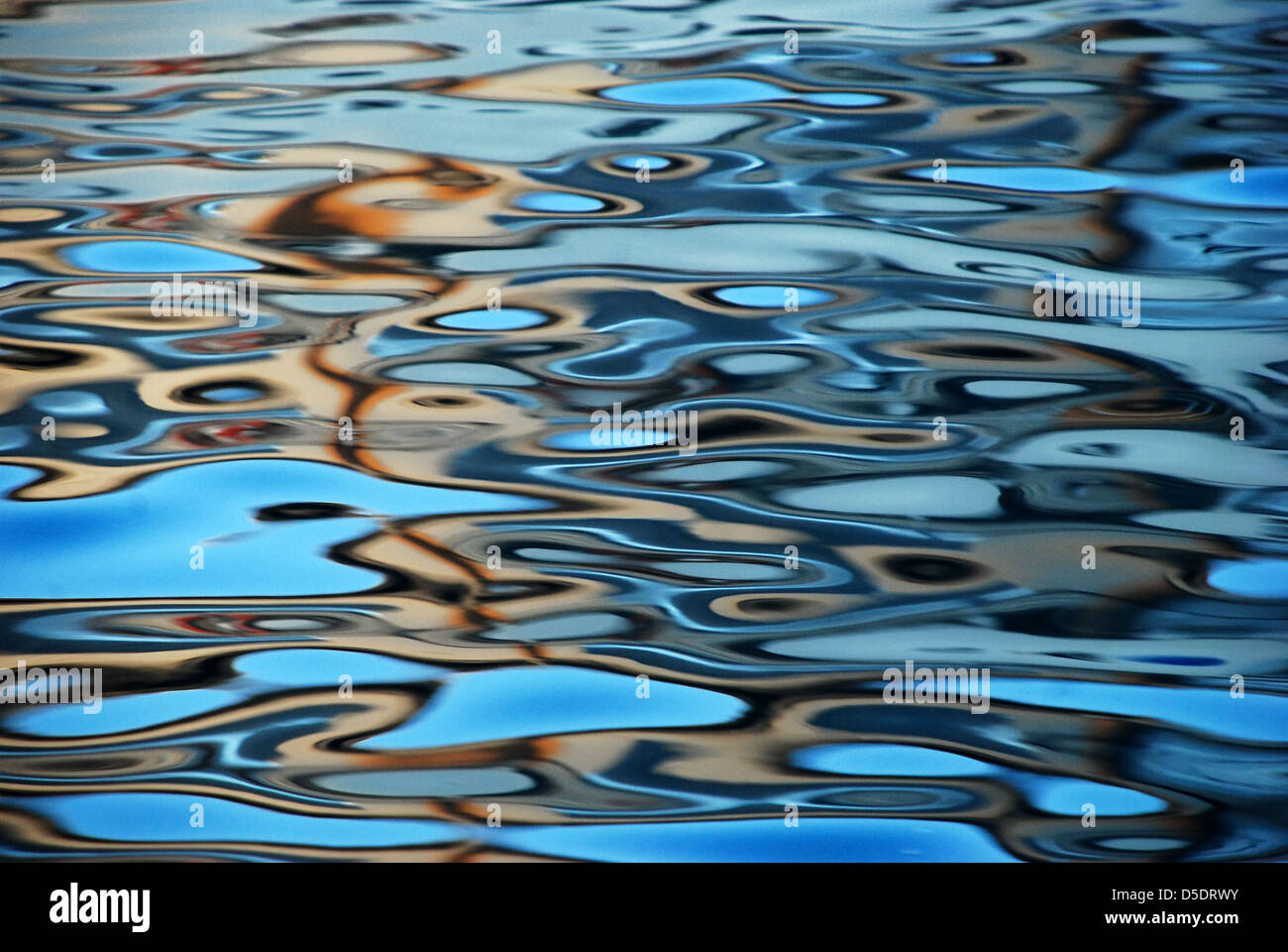 Gentle waves on reflecting water surface hi-res stock photography and ...