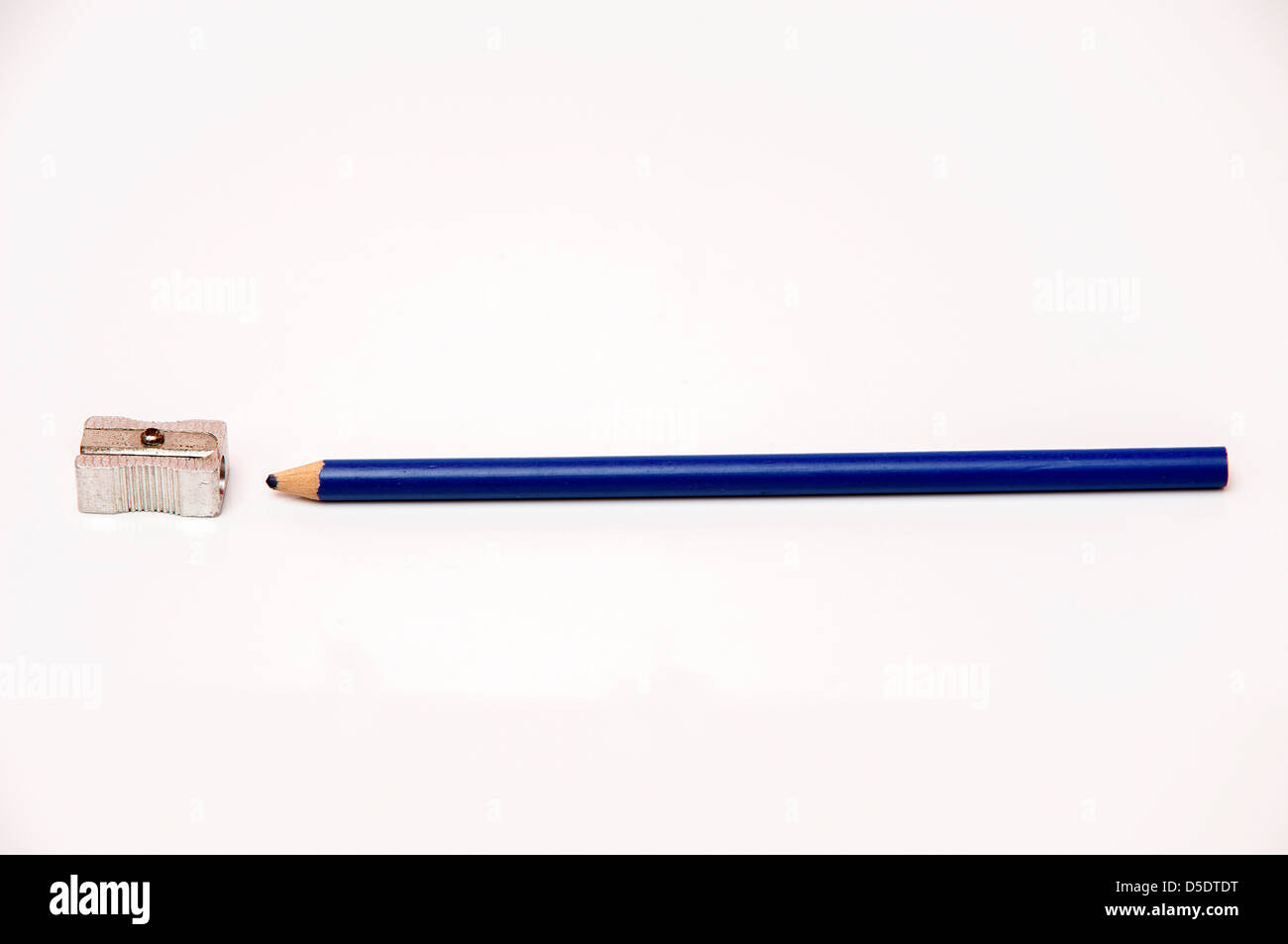 with blue pencil sharpener to sharpen Stock Photo - Alamy